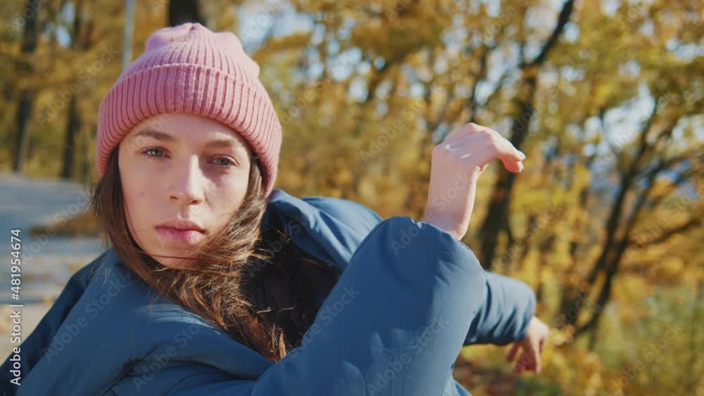 Charismatic young beautiful woman dancing with expressive movements ...