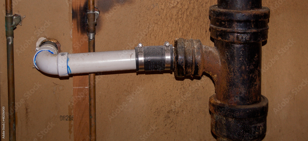 Old residential cast iron plumbing pipes showing rust Stock Photo ...