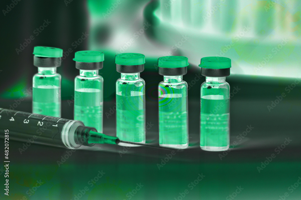 syringe and vials of injectable drugs - green Stock Photo | Adobe Stock