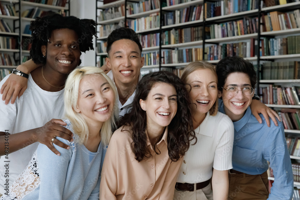Diverse group of cheerful happy student girls and guys posing in ...