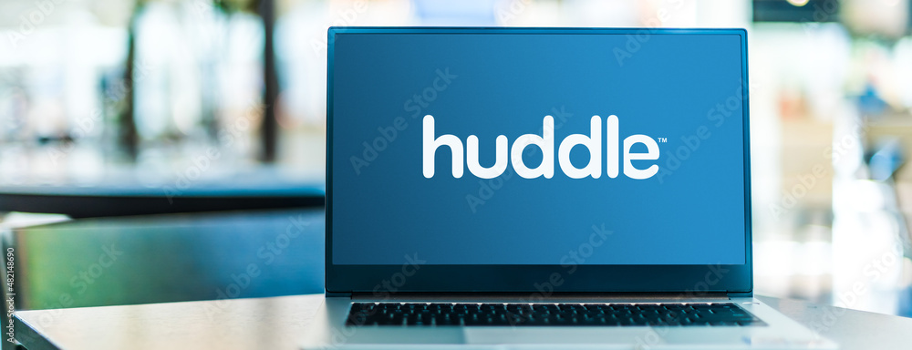 Laptop computer displaying logo of Huddle Stock Photo | Adobe Stock