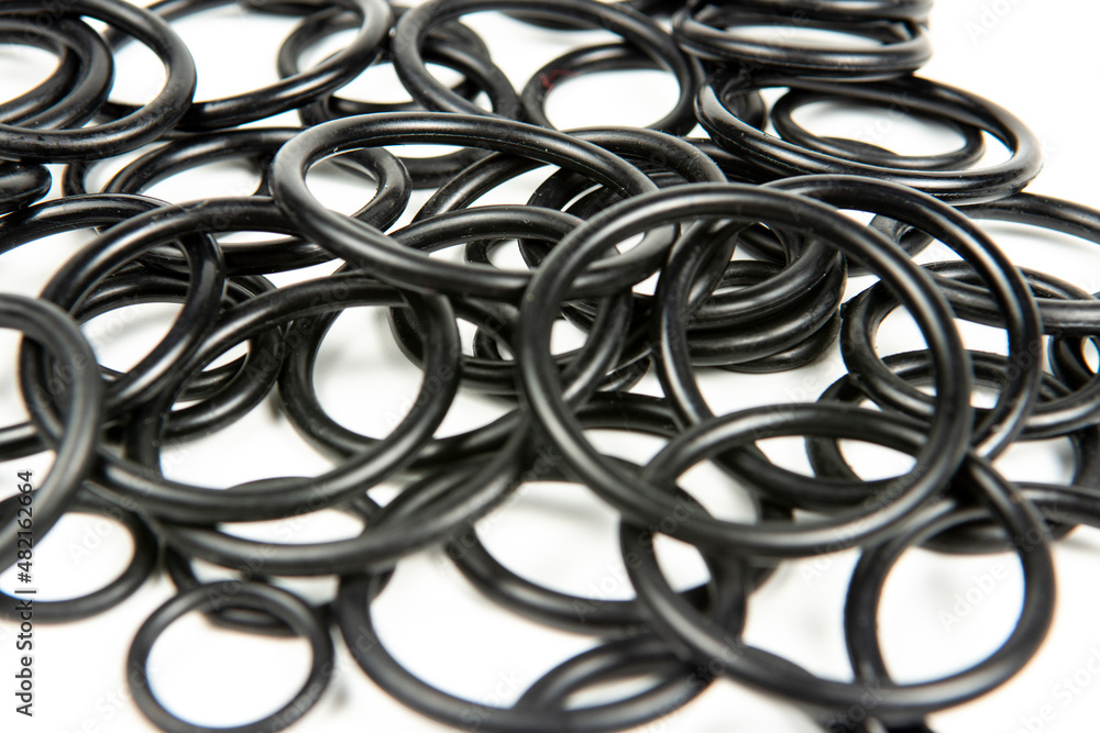 Hydraulic and pneumatic o-rings in black in different sizes on a white ...