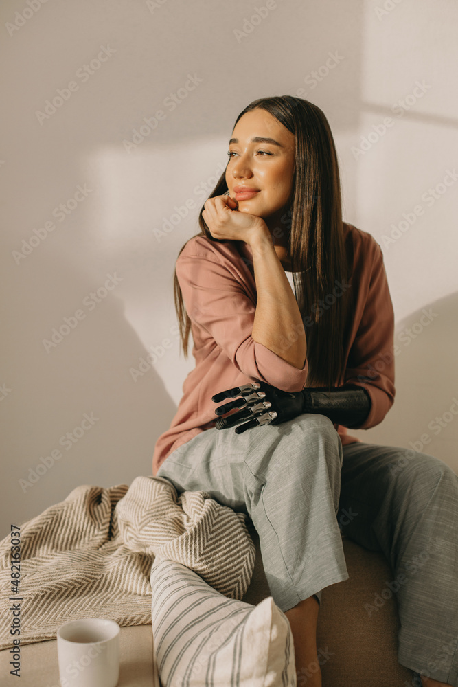 Physically handicapped beautiful woman with black metal bionic ...