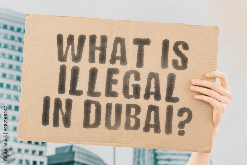 The Question What Is Illegal In Dubai On A Banner In Men s Hand The Question What Is Illegal In Dubai On A Banner In Men s Hand