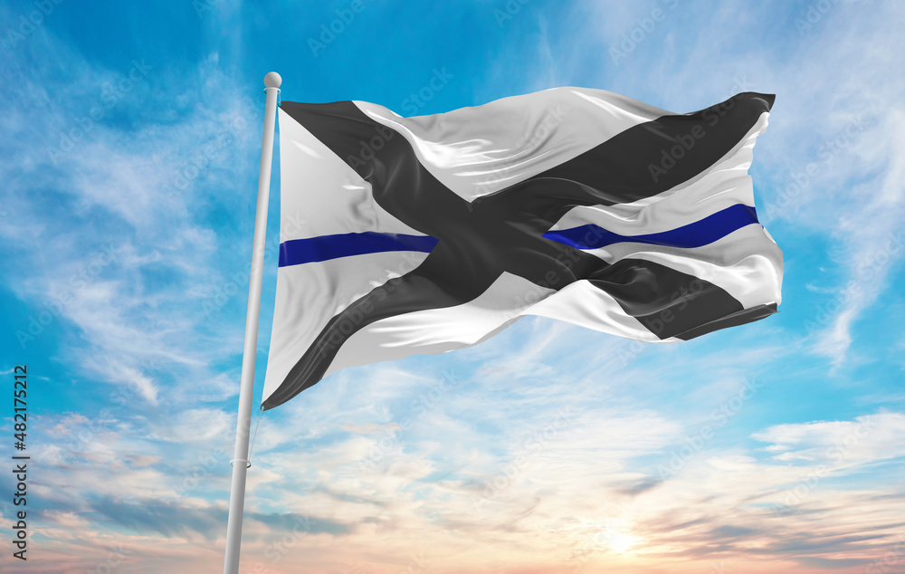 blue line flag of Alabama state, Usa at cloudy sky background on sunset ...