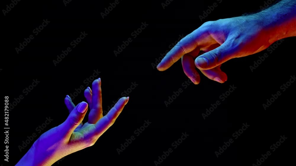 Idea of earth creation. Hands reaching out, pointing finger together on ...