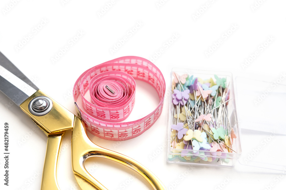 taking measurements on the fabric. Seamstress sewing on the sewing ...