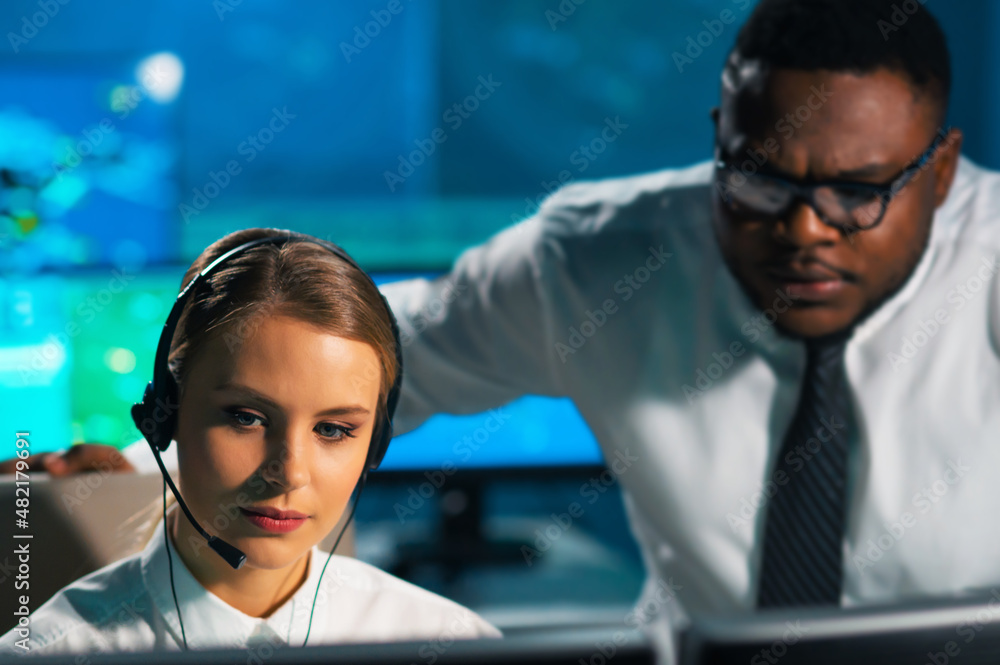 Aircraft flight control officer monitors the approach of aircraft from ...