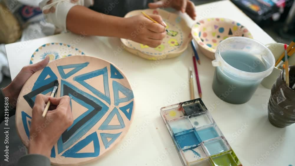 Video Stock 4K Asian woman learning color painting self-made pottery ...