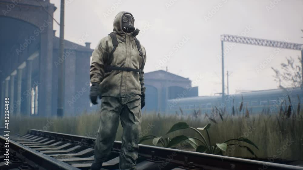One of several survivors walks the railroad tracks in a dystopian post ...