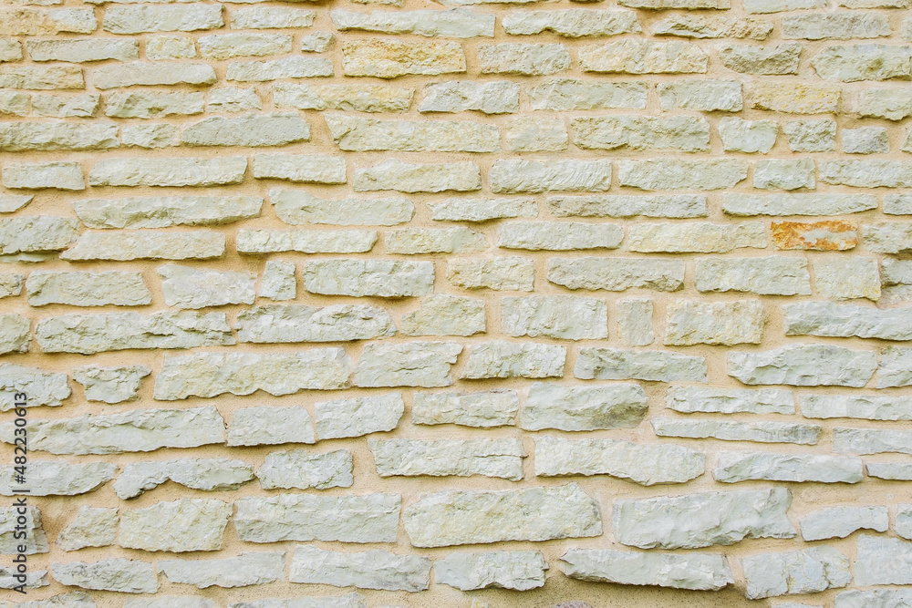 Fragment of ancient medieval fortress wall made of limestone. Vintage ...