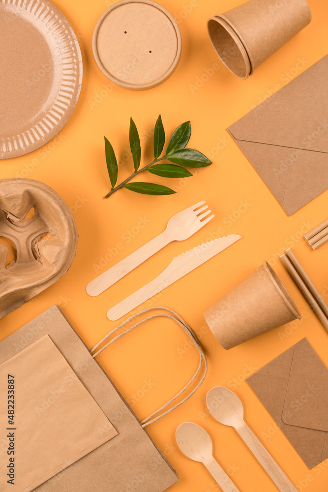 Vertical image with eco-friendly tableware - kraft paper food packaging ...