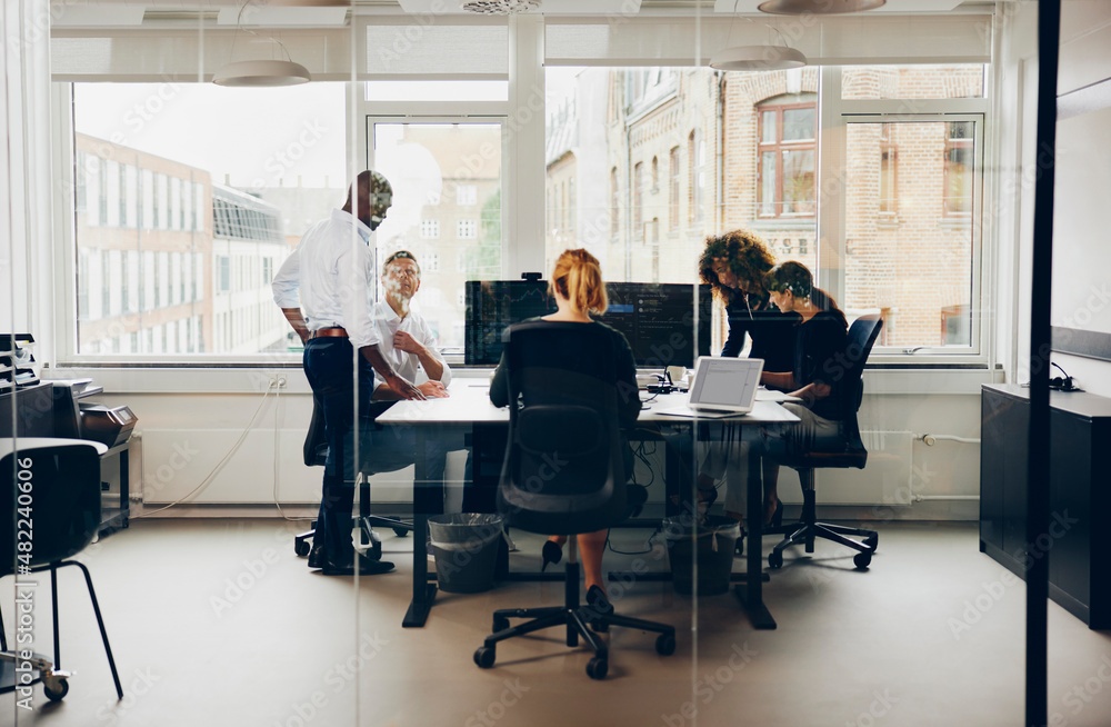 Businesspeople working inside a modern office Stock Photo | Adobe Stock