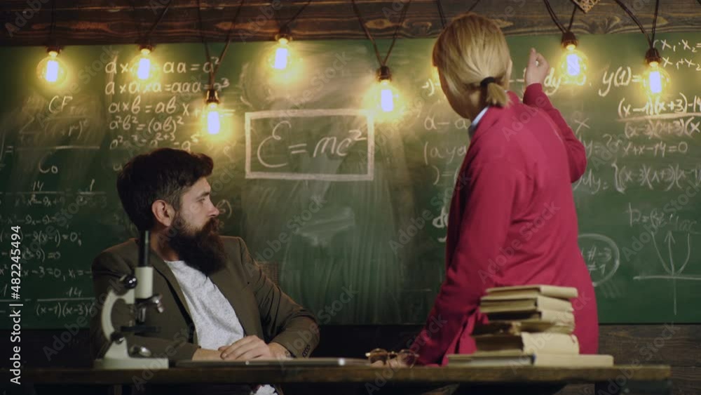 Couple professors. Teacher in math school explanation math lesson ...