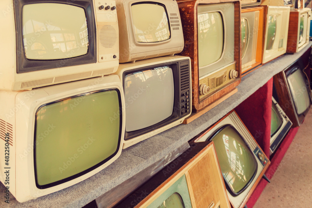 Many retro television. vintage old TV is colorful multi-row. Seeing the ...