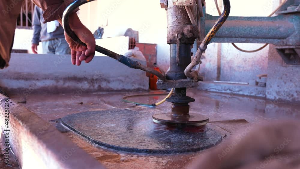 Working of traditional marble machinery. Polishing rocks and ancient ...