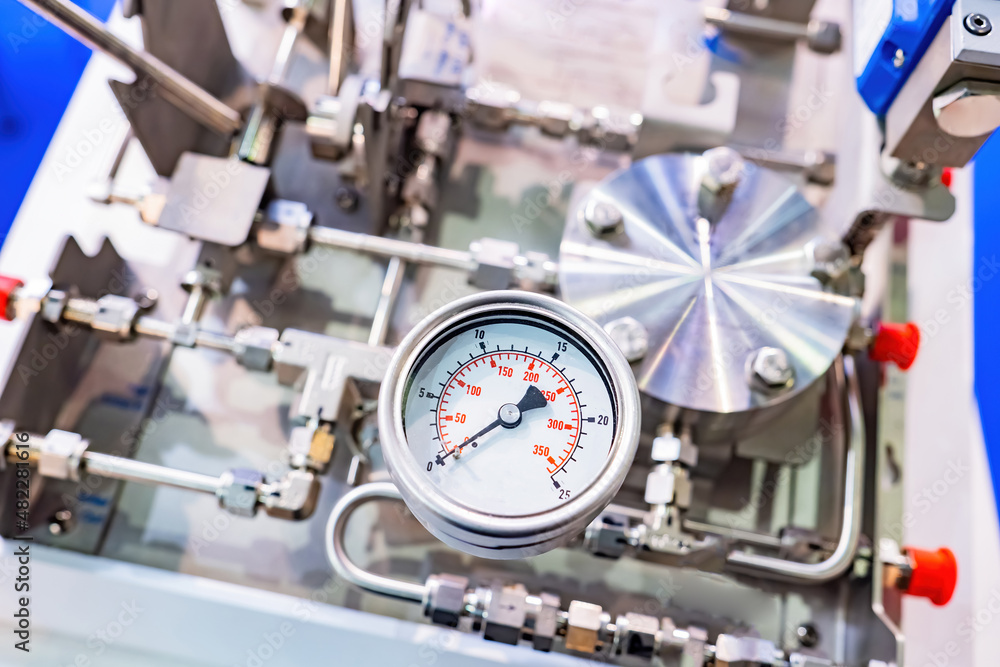 Pressure gauge on production equipment. Close-up pressure sensor ...