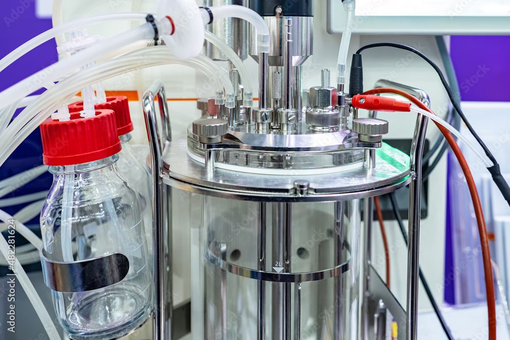 Glass laboratory fermenter. Glass fermenter close-up. Fermenter for ...
