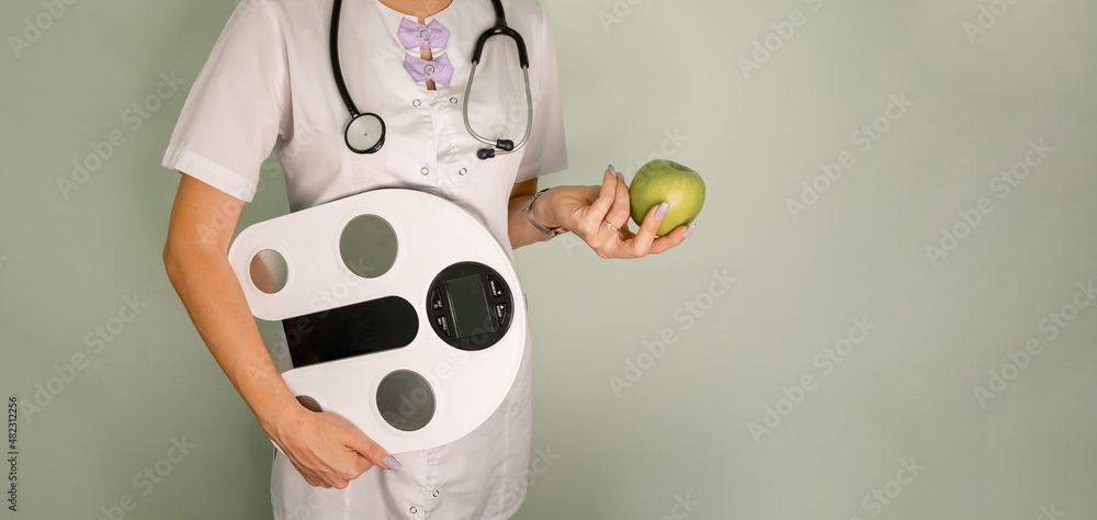 Cute female checking body with a professional scale. Health care ...