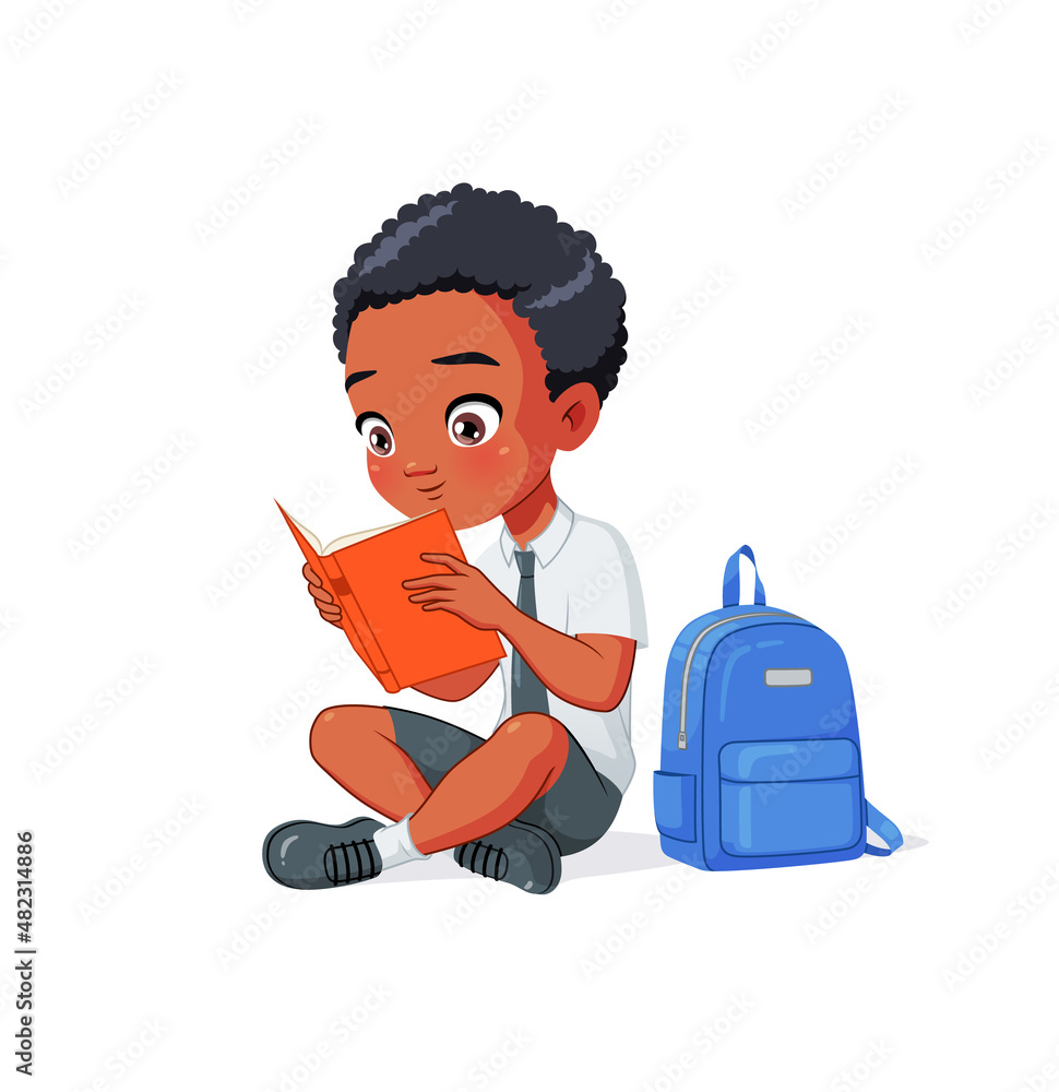 Cute African American school boy in reading book sitting on the floor ...