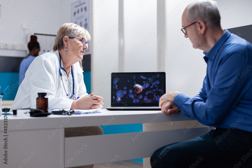 Doctor and patient discussing about illustration of coronavirus on ...