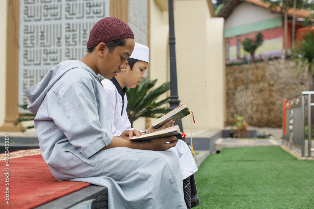 Side view The Islamic boarding school students are reading the Koran in ...