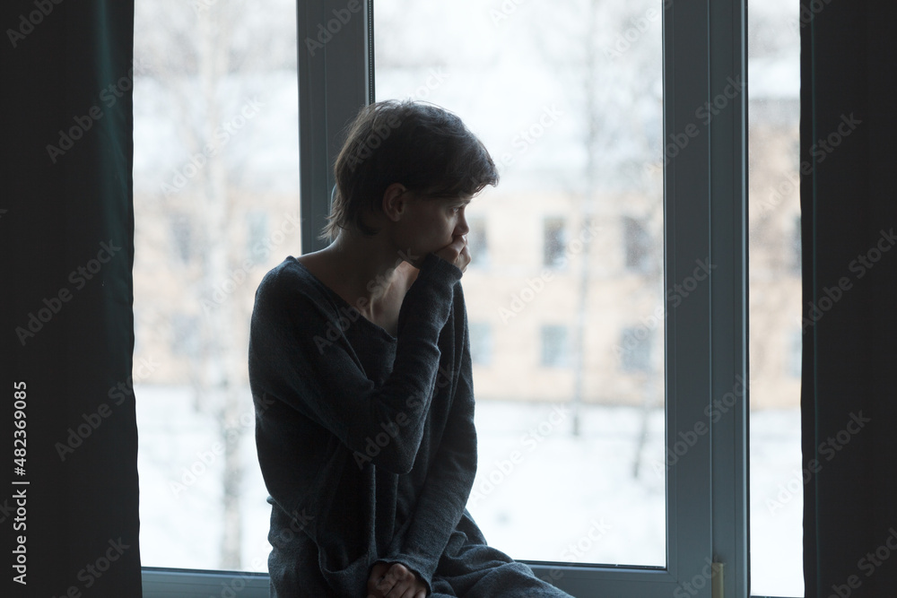 Sad stressed woman sitting alone suffering mental pain Stock Photo ...