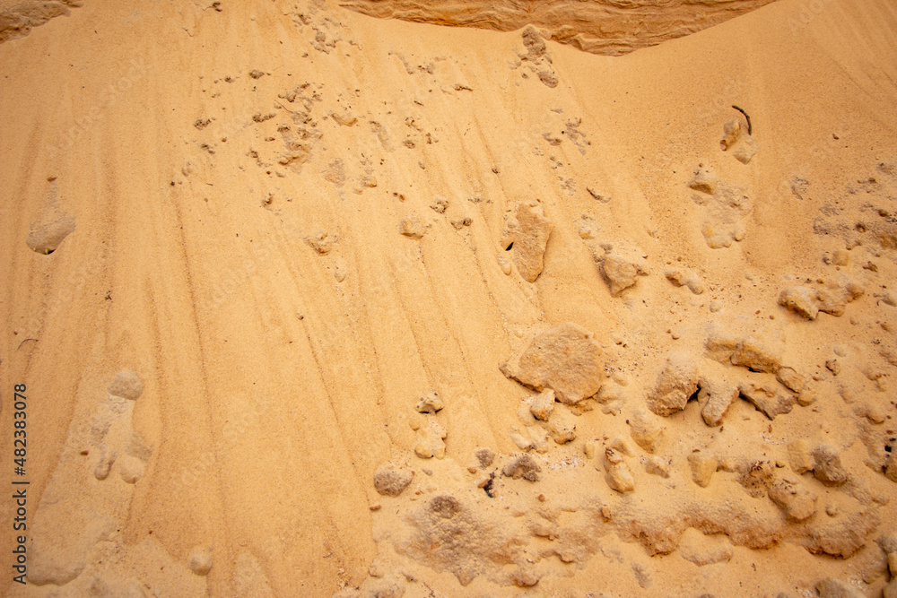 Textural sand, with relief surface, multi-colored layers and different ...