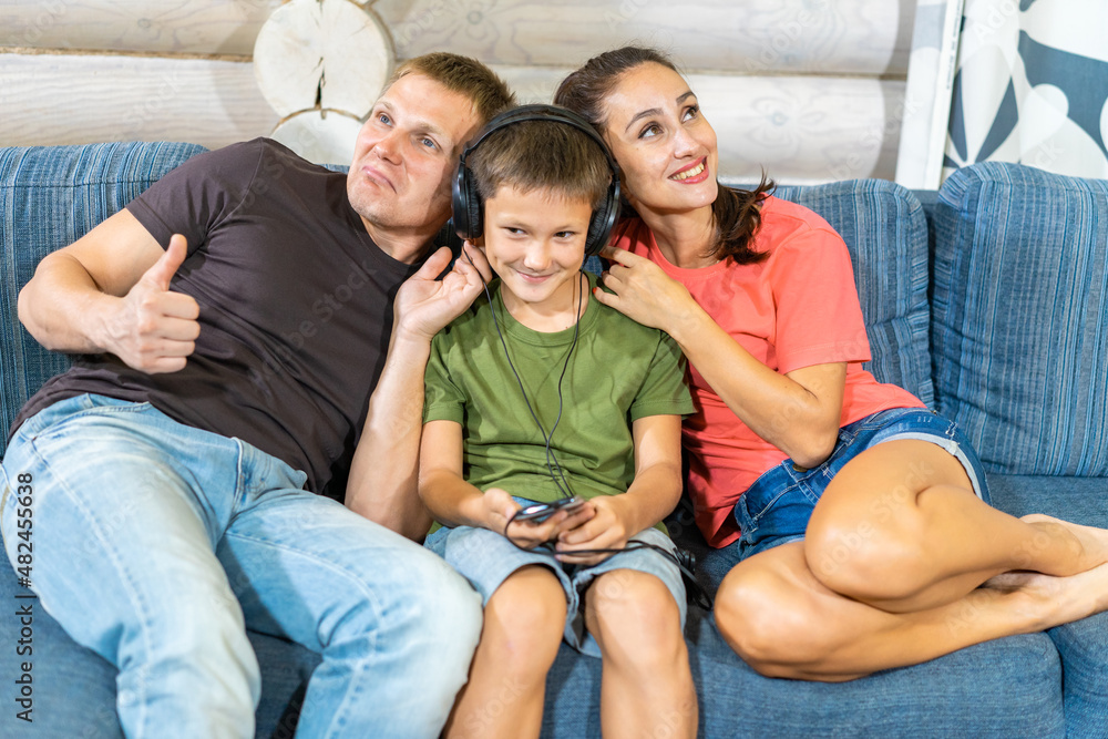 parents control the child. Mom and Dad are eavesdropping. boy listens ...