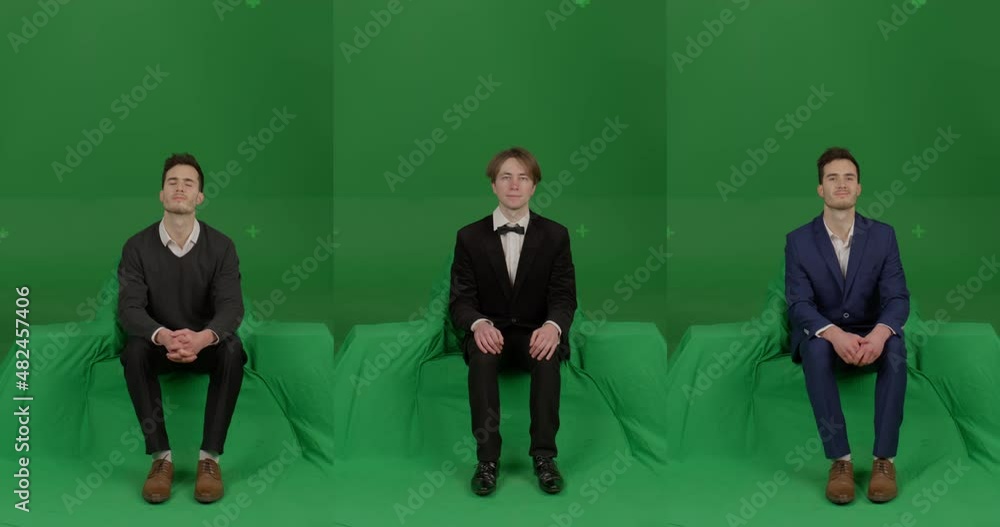 GREEN SCREEN CHROMA KEY Front view of spectators wearing formal attire ...