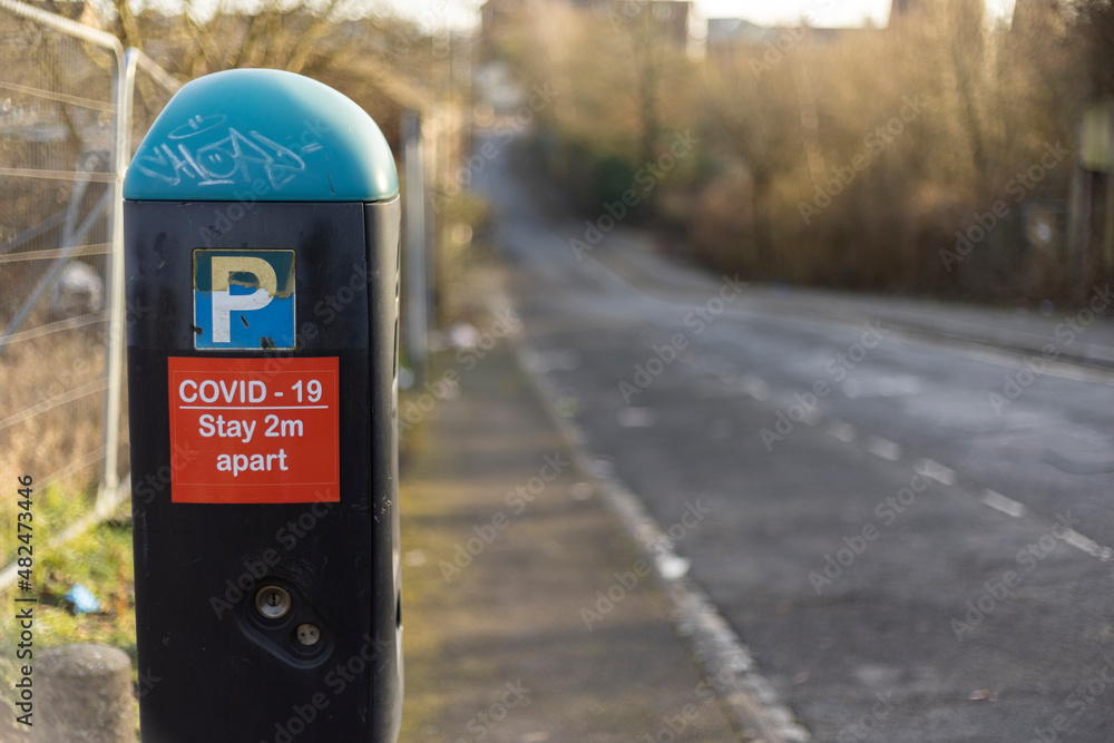car parking meter with social distance warning sign Stock Photo | Adobe ...