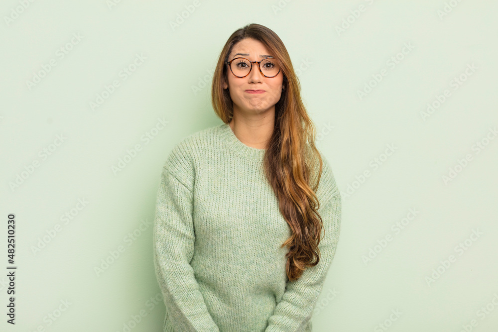 asian woman with a goofy, crazy, surprised expression, puffing cheeks ...