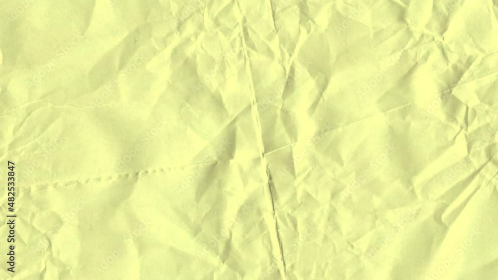 Video background, light yellow colored wrinkled paper texture ...