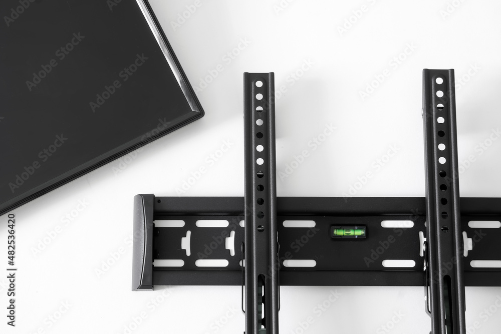 Black metal bracket for wall mounting TV and monitor screen on white ...
