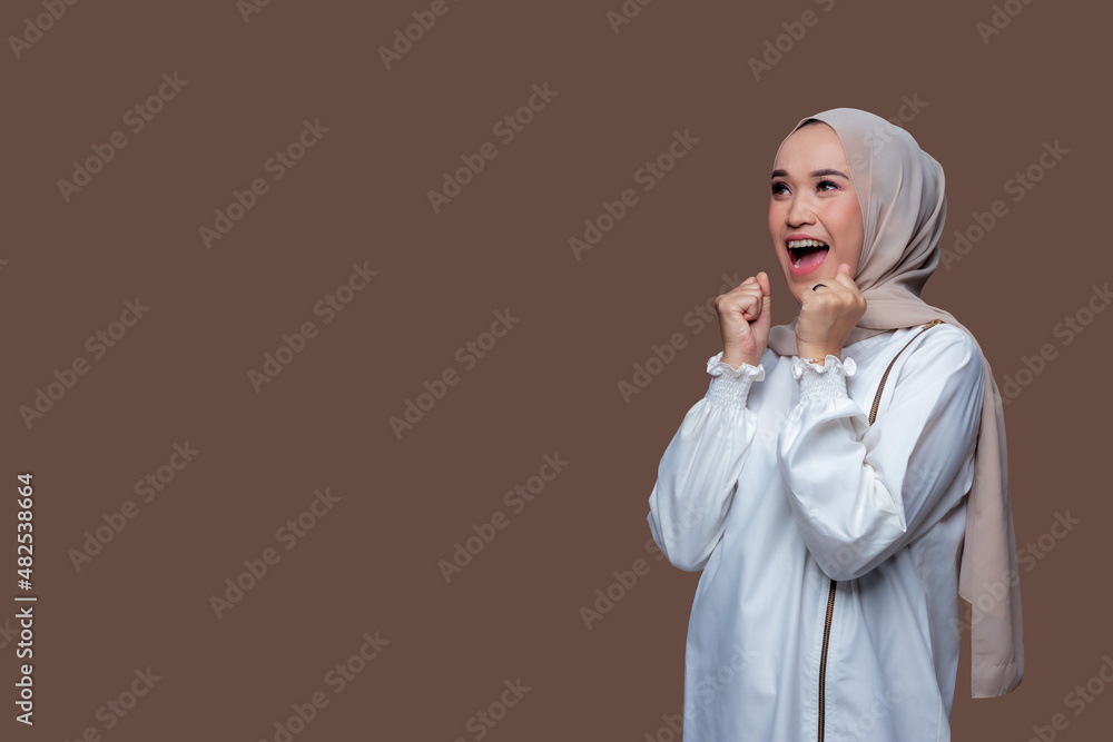 Beautiful hijab woman celebrating success. Muslim woman with screaming ...