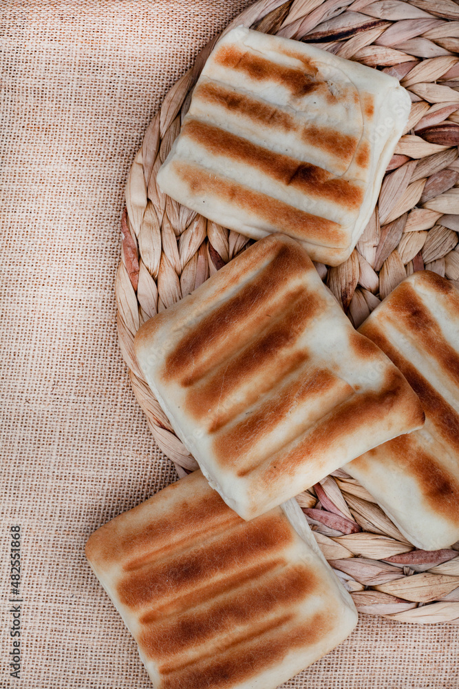 Traditional South African Braai bread or roosterbrood, cooked on open ...
