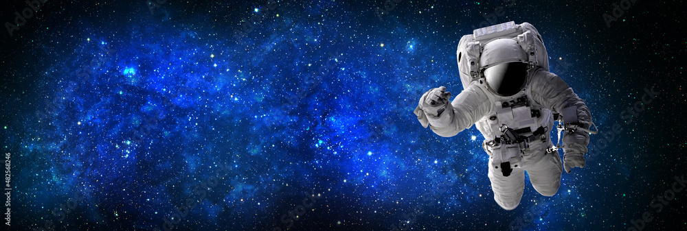 Astronaut flying in outer,open space,which is behind.Abstract space ...