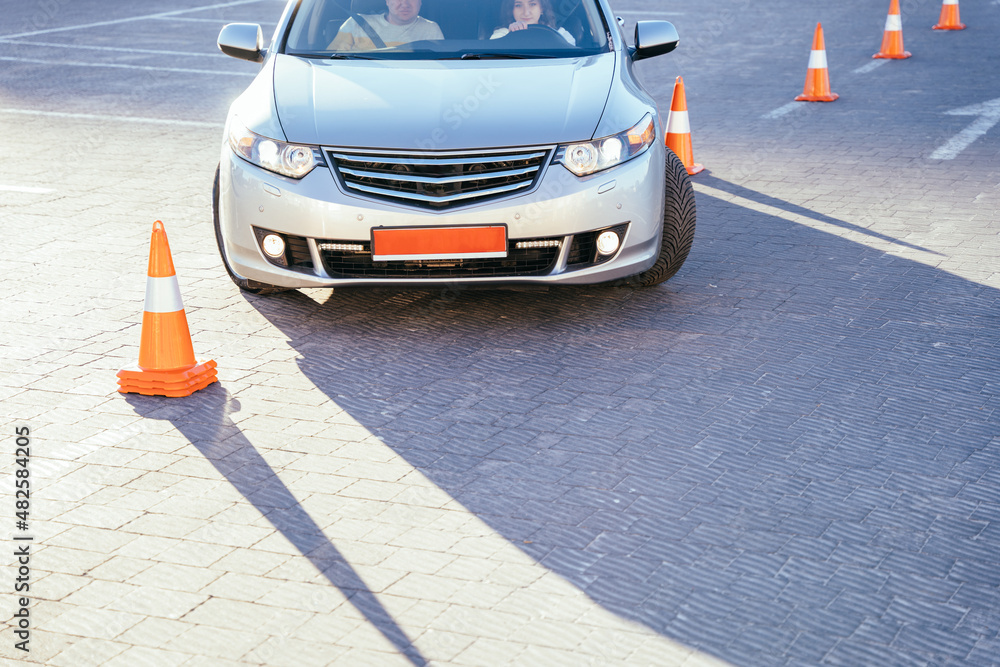 Learning to drive, people concept. Alert young woman student driver ...