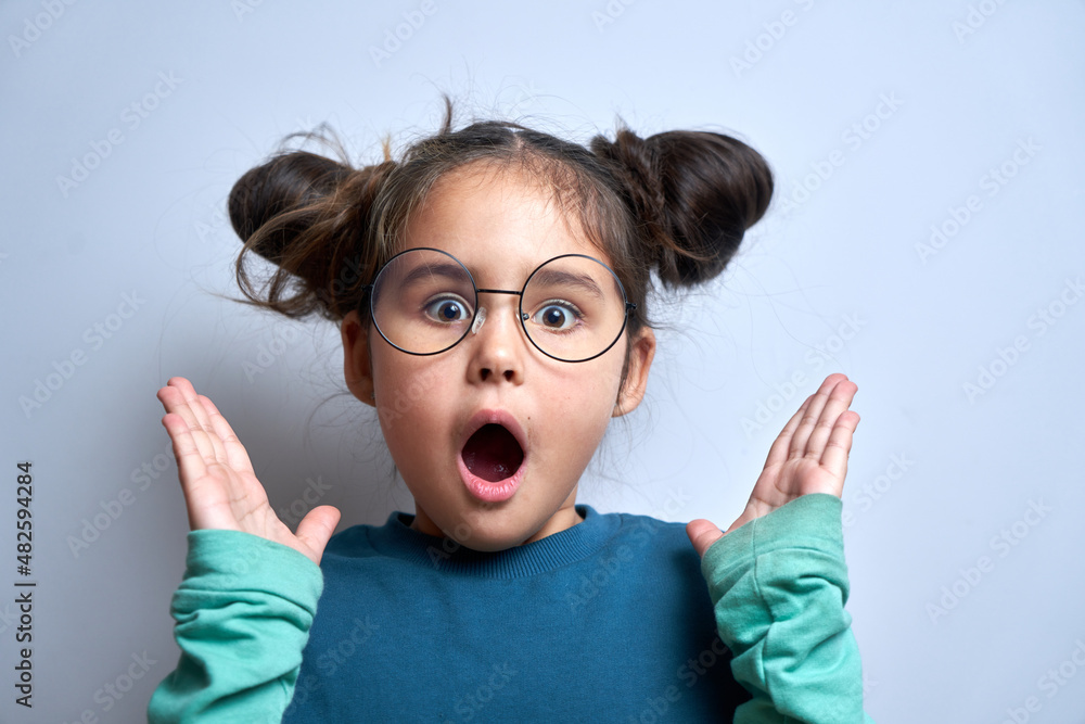 Funny little girl with shocked face and surprised open mouth closeup ...