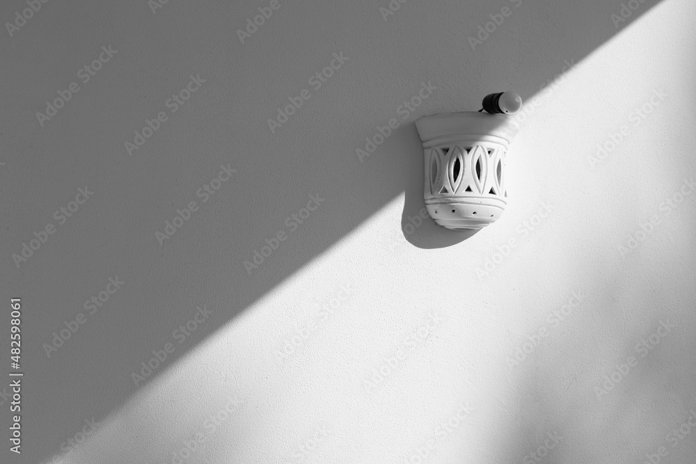 White wall with grey shadow . Half white half grey. Summer light ...