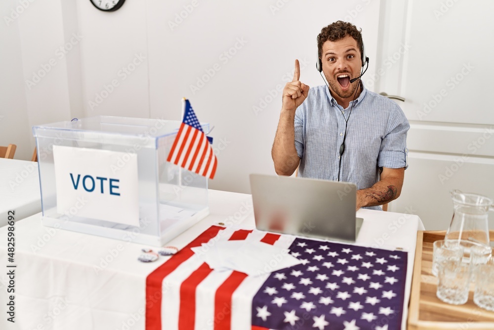 Handsome young man working at political campaign wearing operator head ...