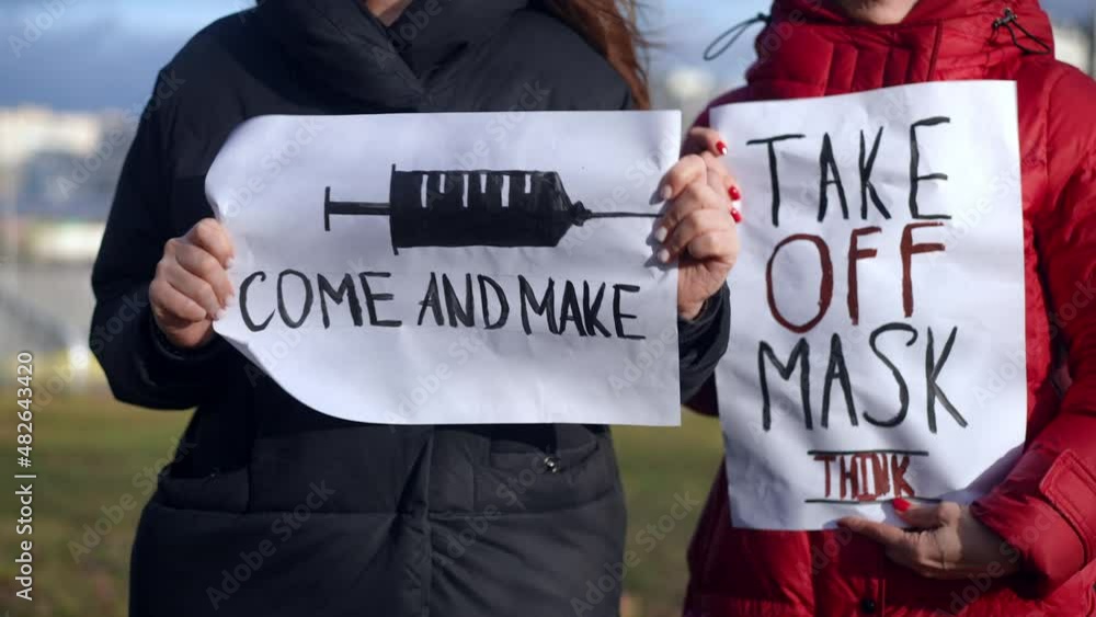 Close-up Come and make banner in hands of female activist with woman ...