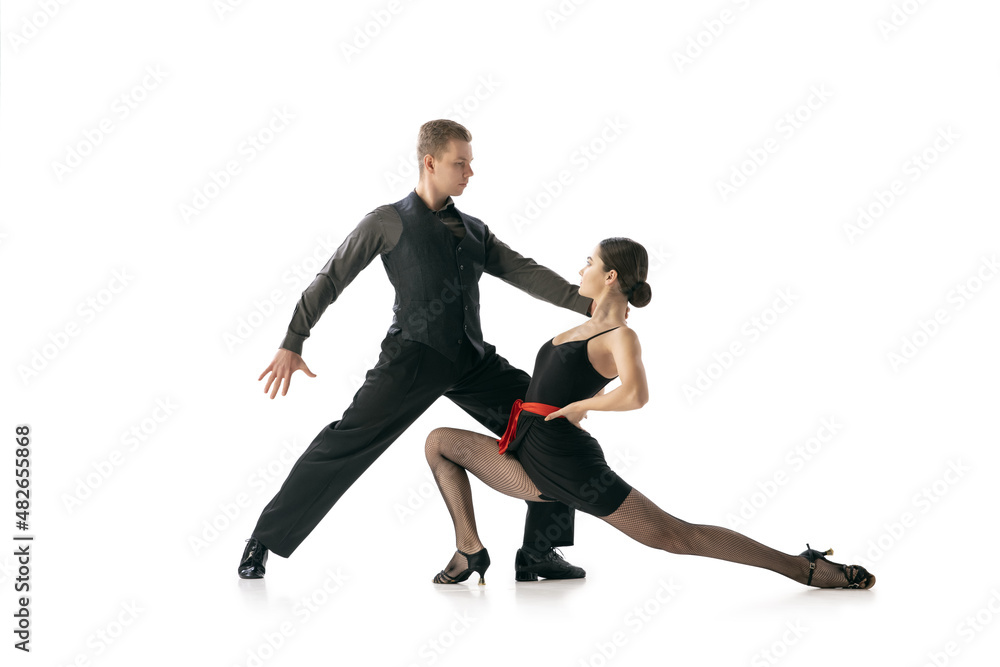 Dynamic portrait of flexible young dancers dancing Argentine tango ...