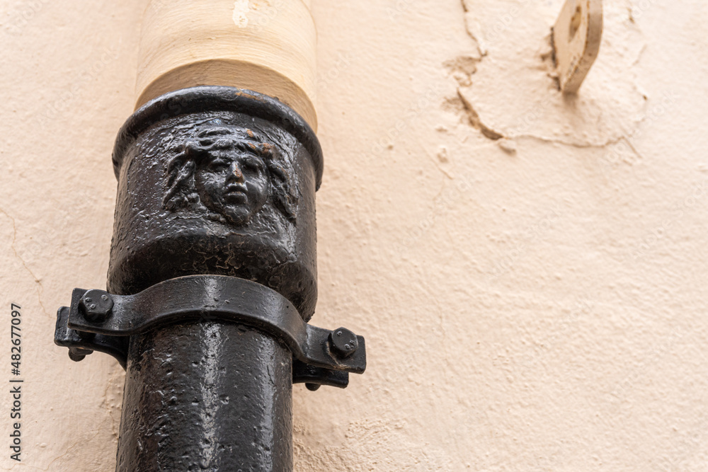 Human figure forged in a metal water pipe, typical of the towns of ...
