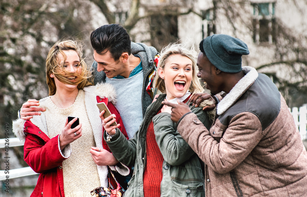 Multicultural group of milenial friends walking at London city center ...
