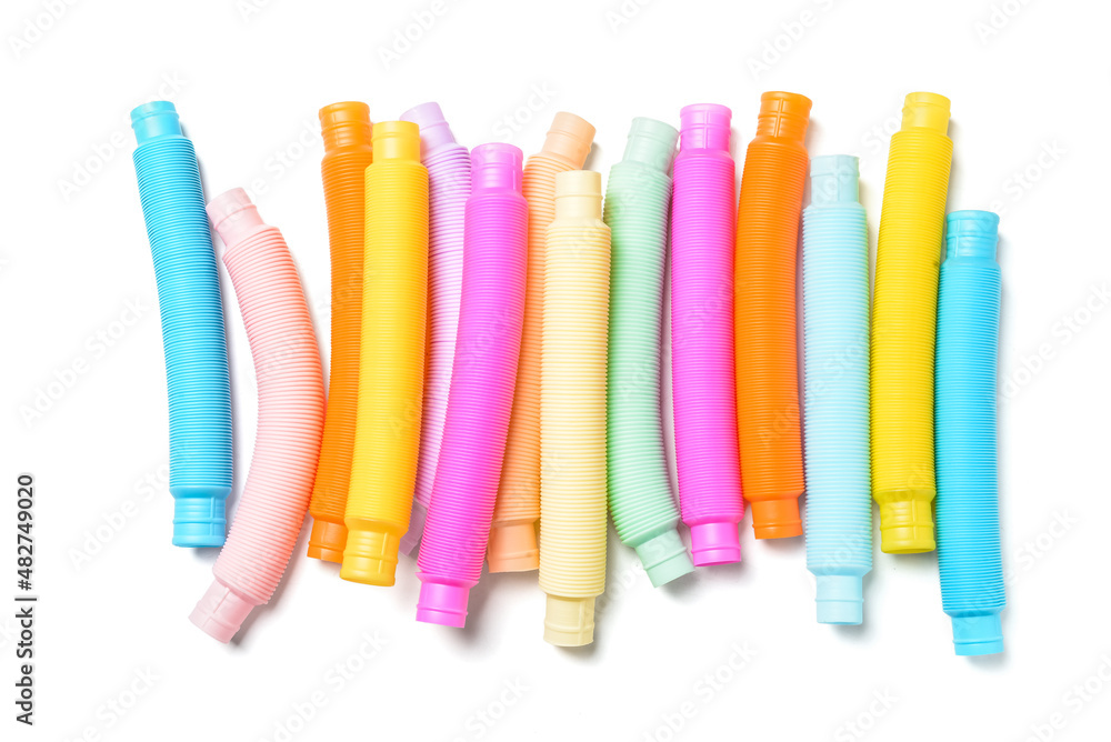 Different colorful Pop Tubes on white background Stock Photo | Adobe Stock