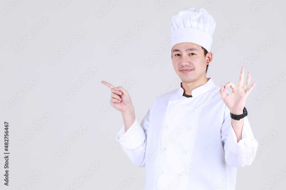Experienced and smart chinese chef on elegant cooking uniform smile and ...