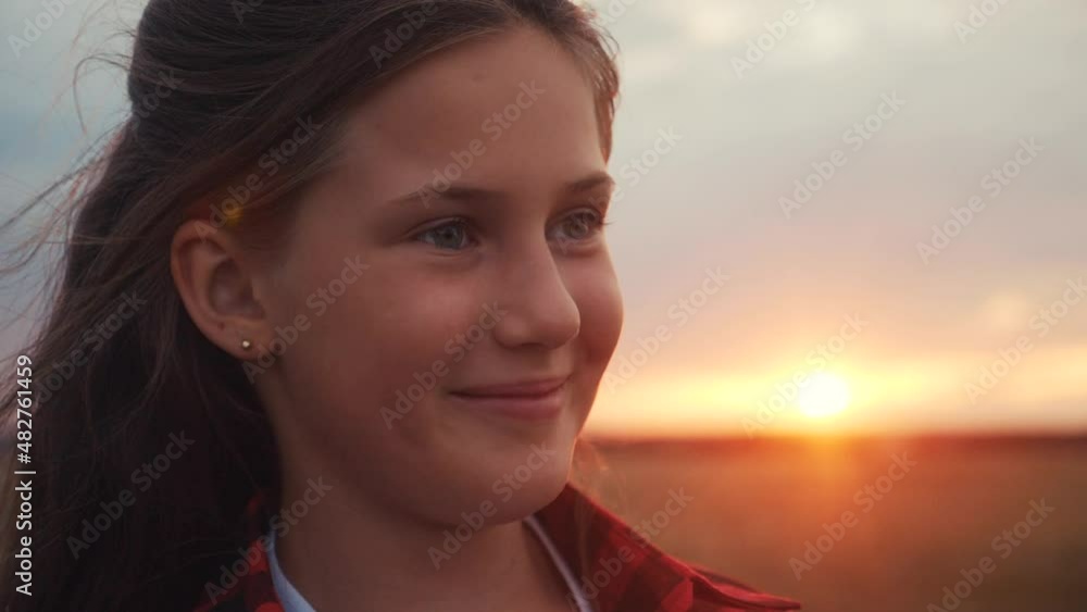 portrait teen girl dreaming in the park at sunset. happy family kid ...