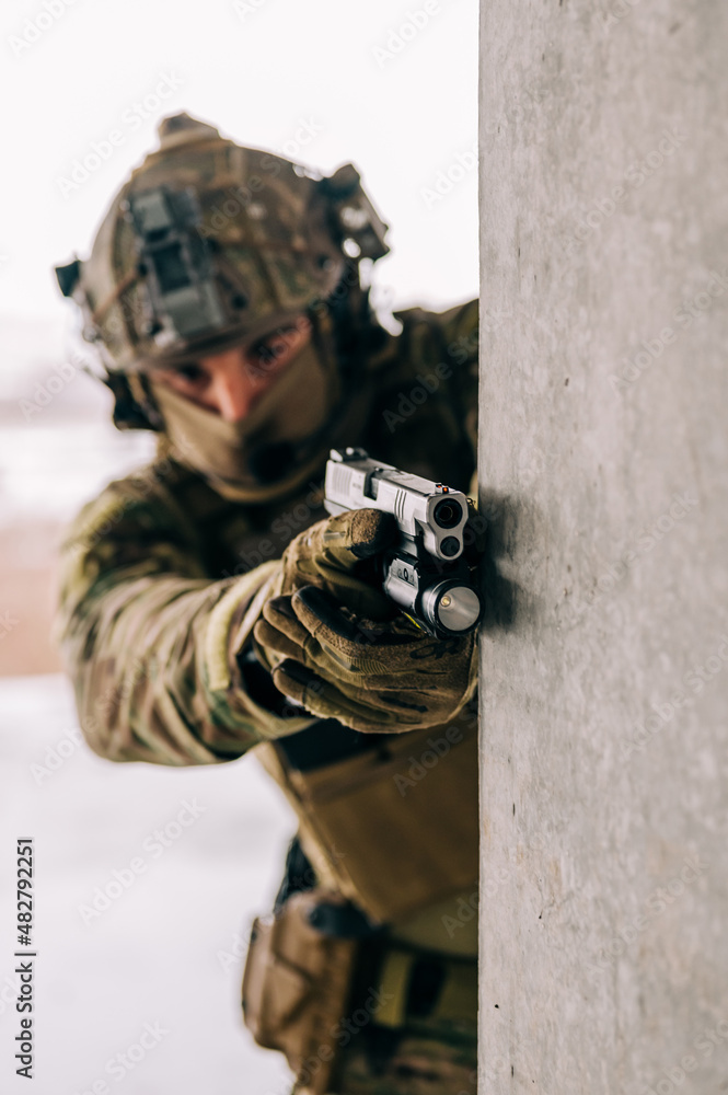Special forces operator wearing Multicam uniform and his handgun xdm ...