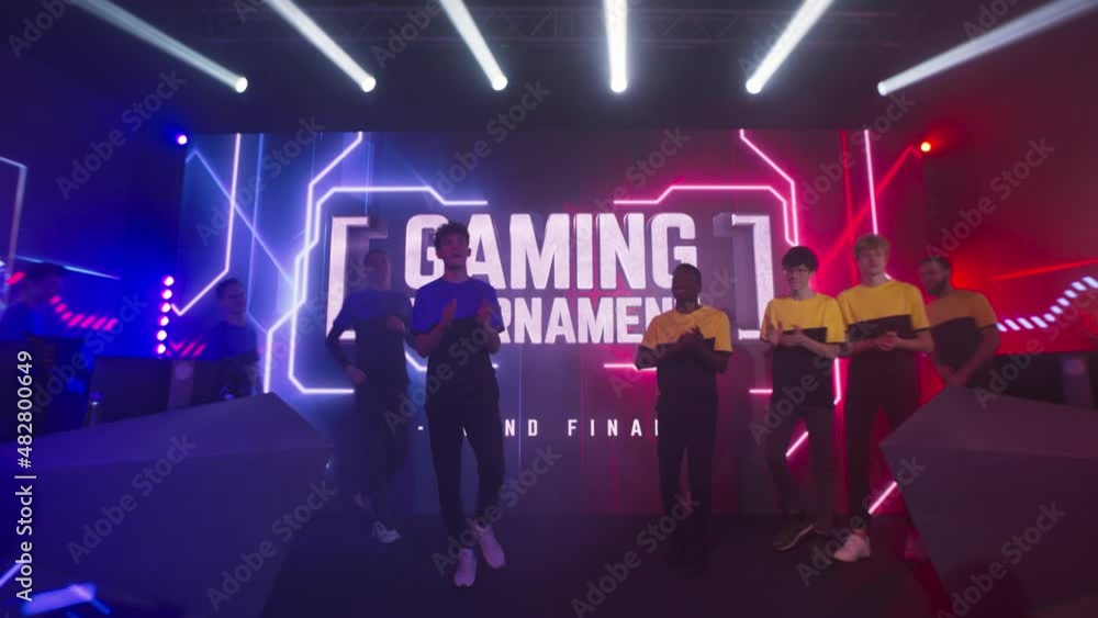Group of teammates esport gamers walking and clapping hands then ...
